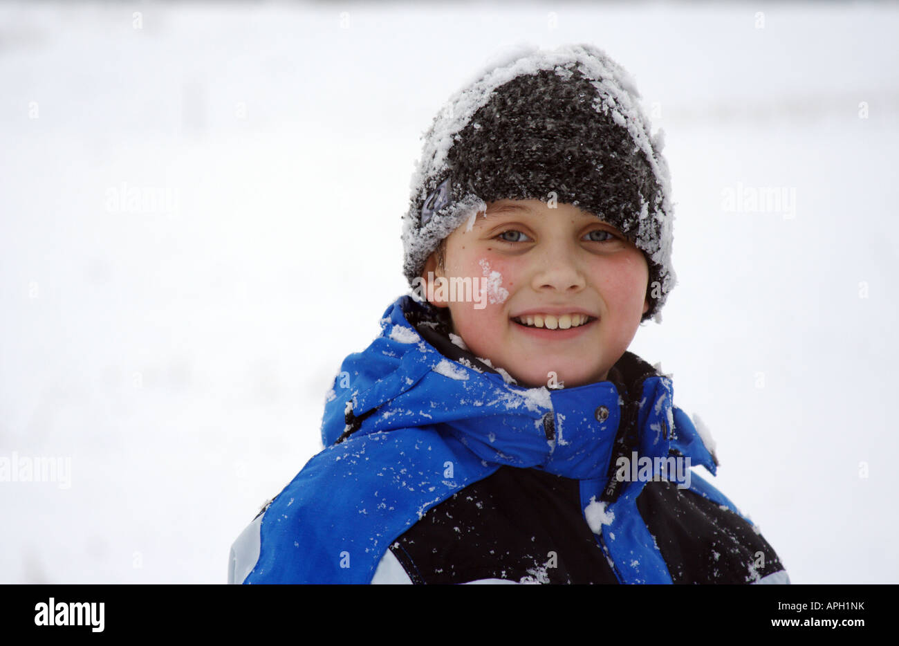 Boy covered with snow Stock Photo - Alamy