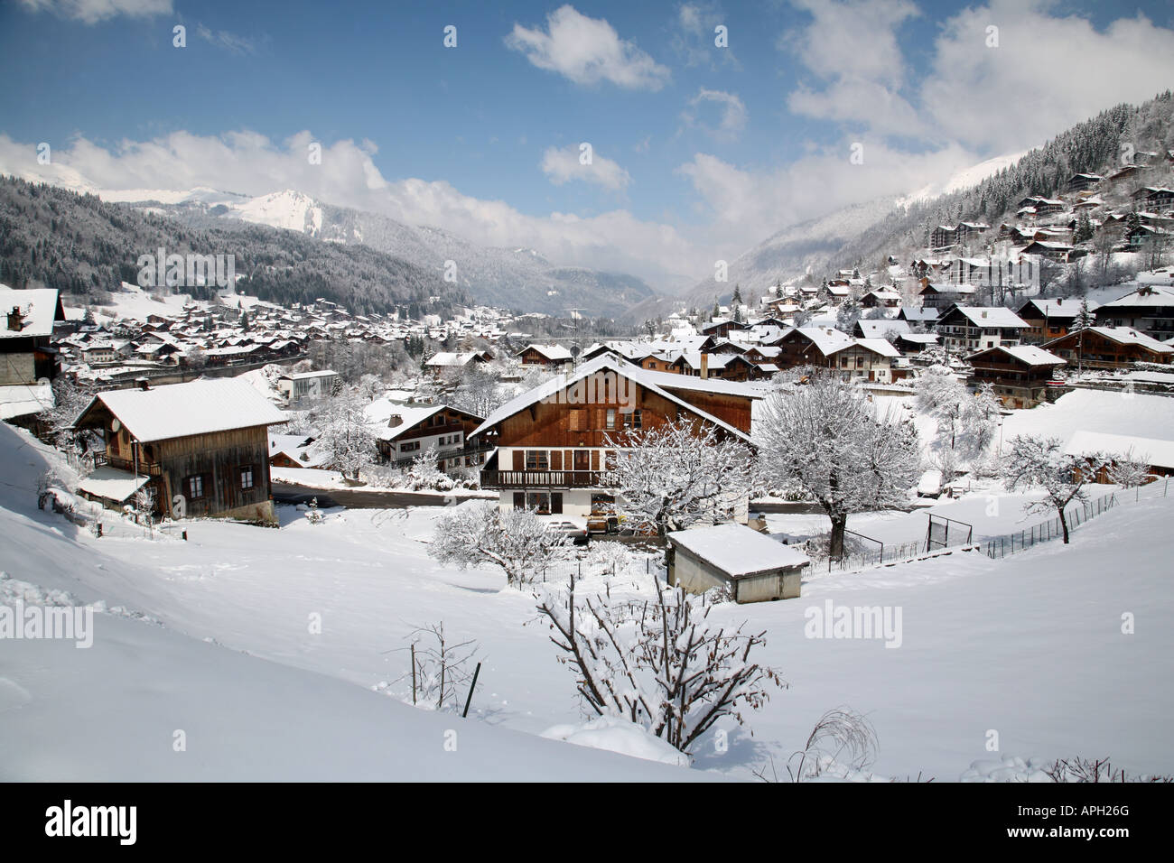 Winter scene in a winter landscape, France; Chalets in winter covered ...