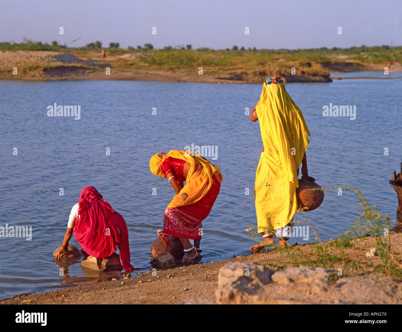Indian village women fetching water in earthenware pots Stock Photo - Alamy