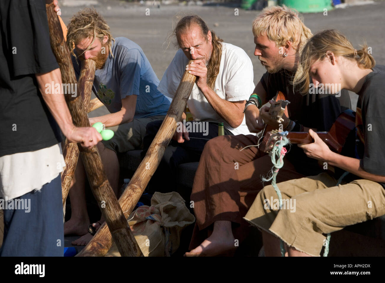 Hippies are sitting on the beach of La Playa a small village in Valle ...