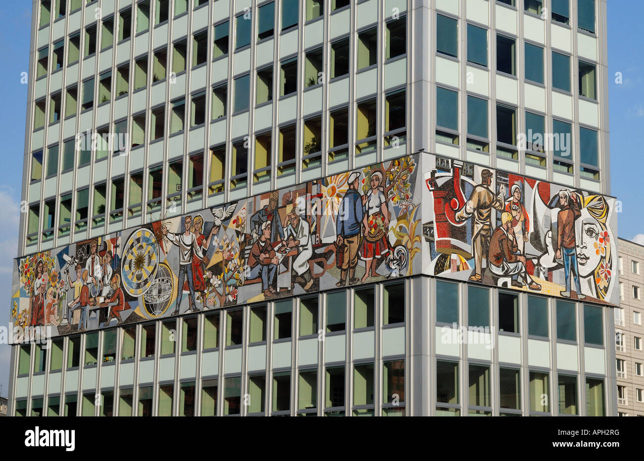 Communist mural on facade of office building at Alexanderplatz, Berlin ...