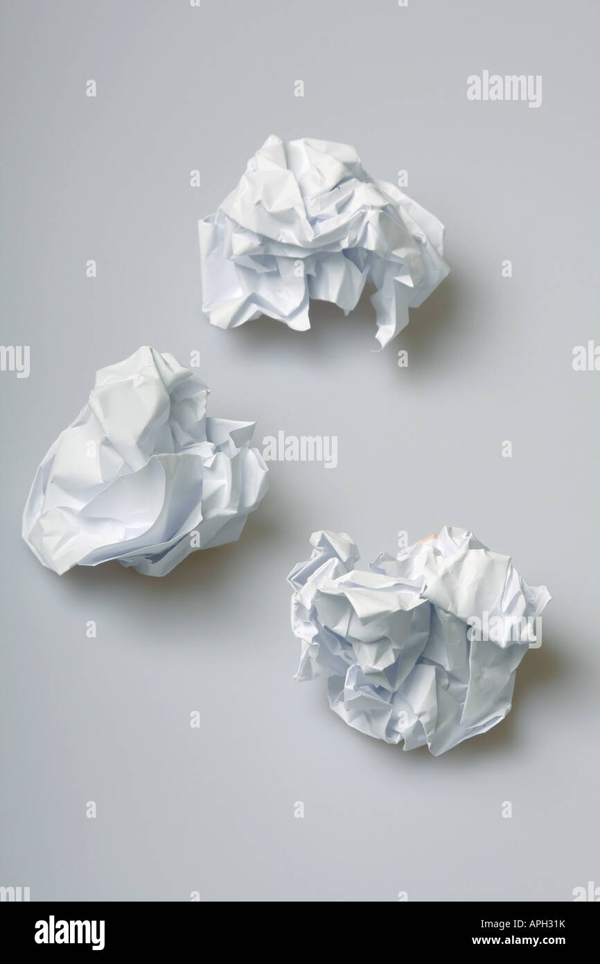 Crumpled paper wads on the floor concept for creative block Stock Photo ...