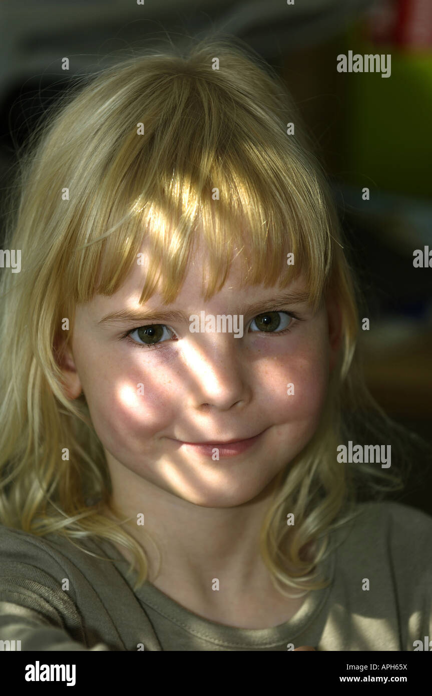 blond young child smile girl sweet light shadow reflection Stock Photo ...