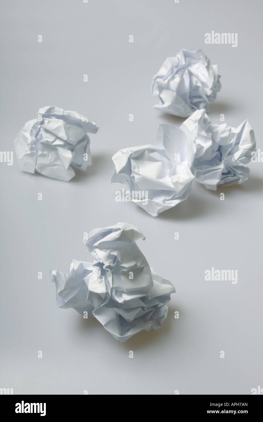 Crumpled paper wads on the floor concept for creative block Stock Photo ...