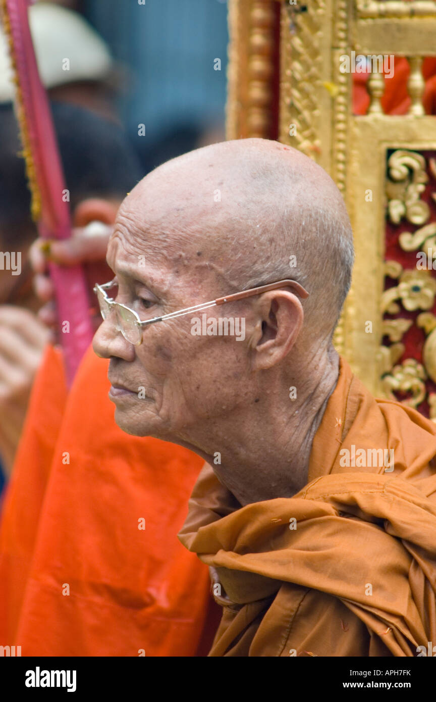 Elderly monk soaked with water during the Pi Mai parade on Sisavangvong ...