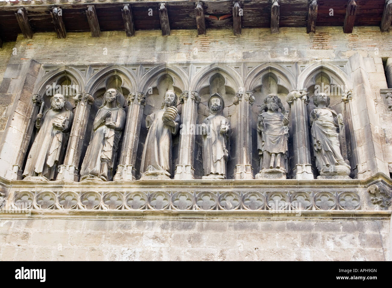 Damaged stone statues of the 12 apostles on church walls at Estella ...