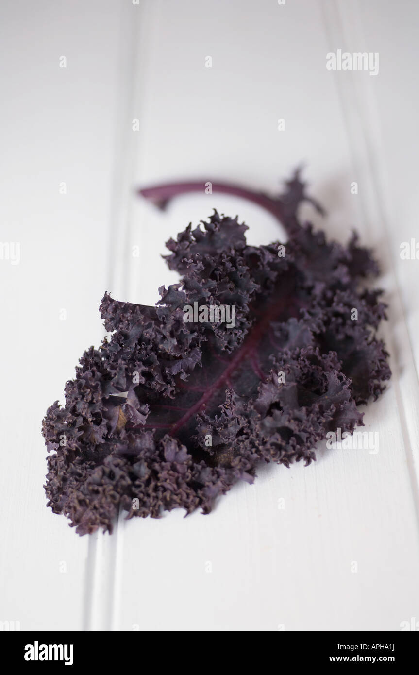 Purple Kale of wooden table Stock Photo - Alamy