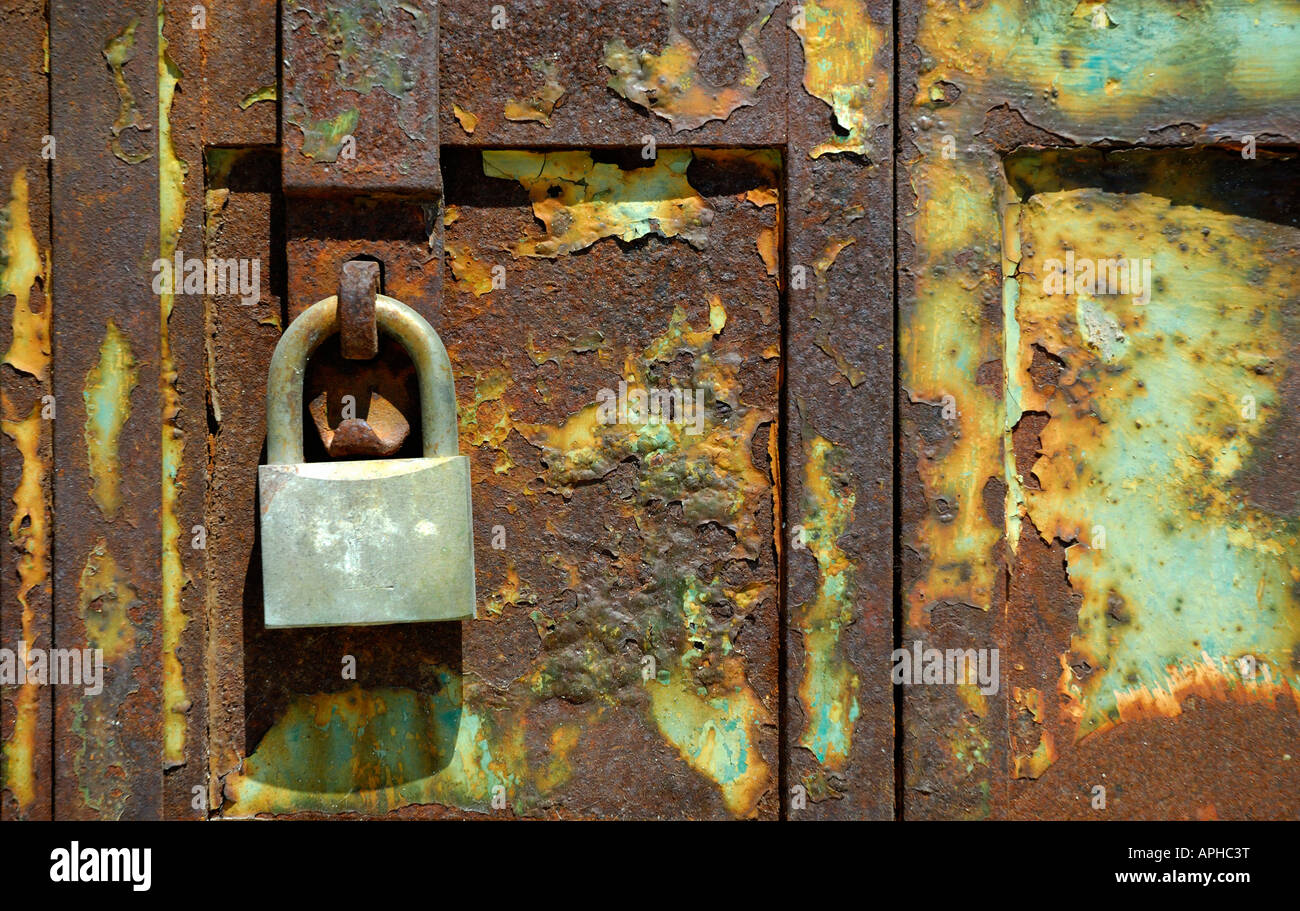 RUSTY METAL PADLOCK IN ABANDONED DOOR Stock Photo - Alamy