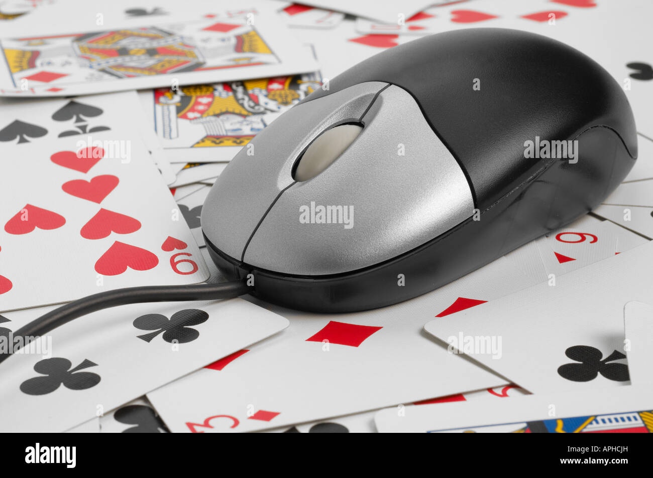 Computer mouse on playing cards Stock Photo - Alamy