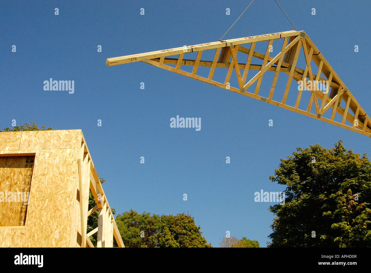 Crane delivering trusses for residential home, West Seattle Stock Photo ...