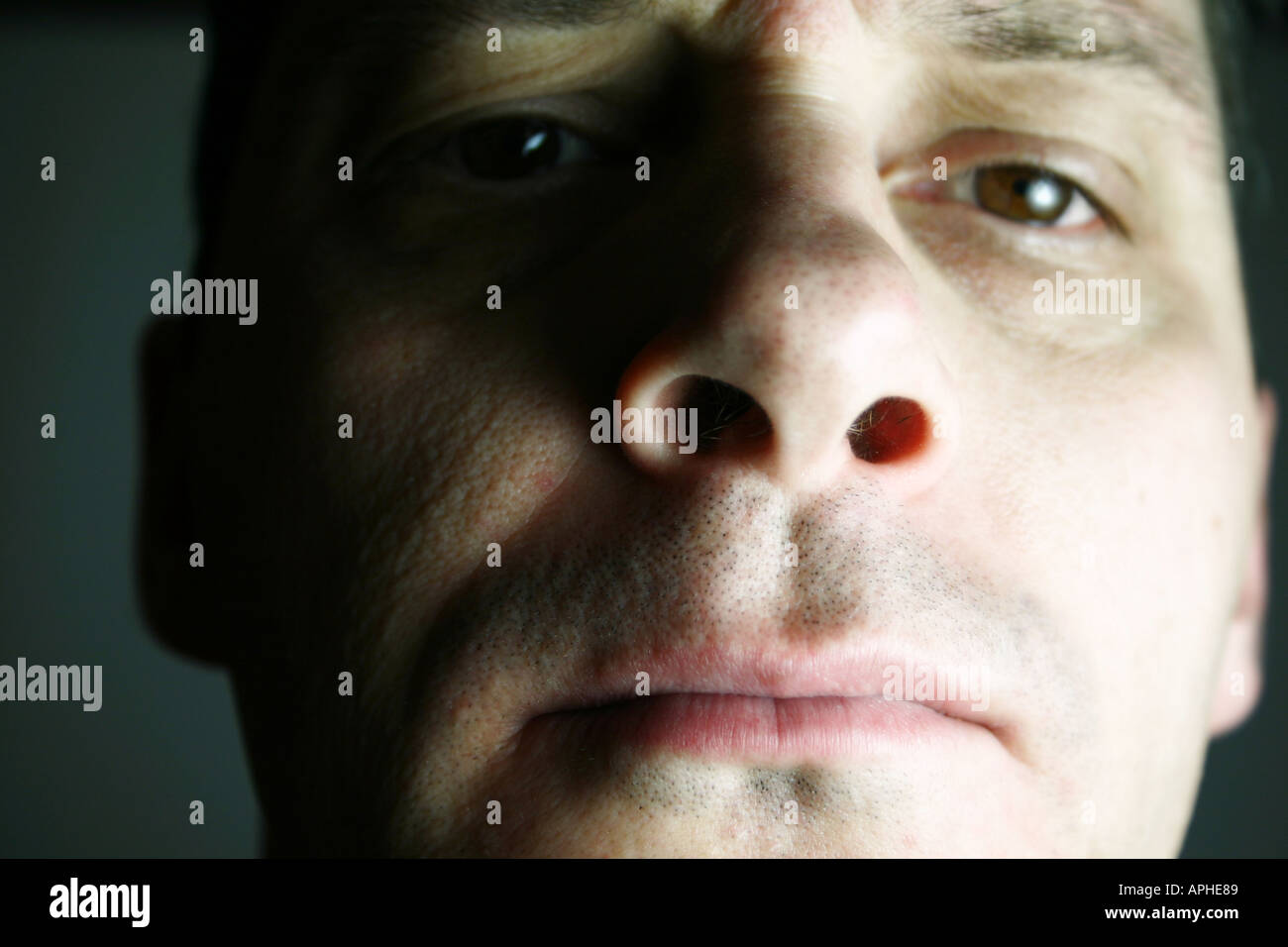 Close up of male inquisitive face Stock Photo - Alamy