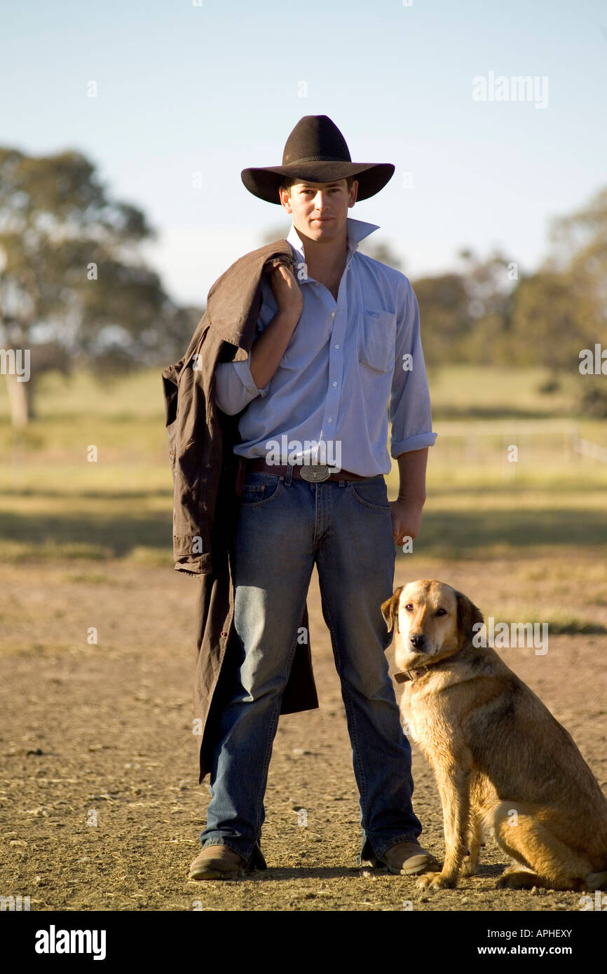 Portrait of farmer with working dog Stock Photo - Alamy