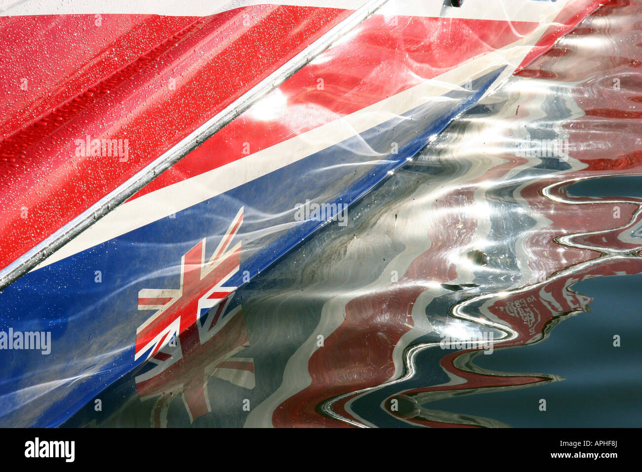 British coat, red white and blue union flag reflected in the water ...