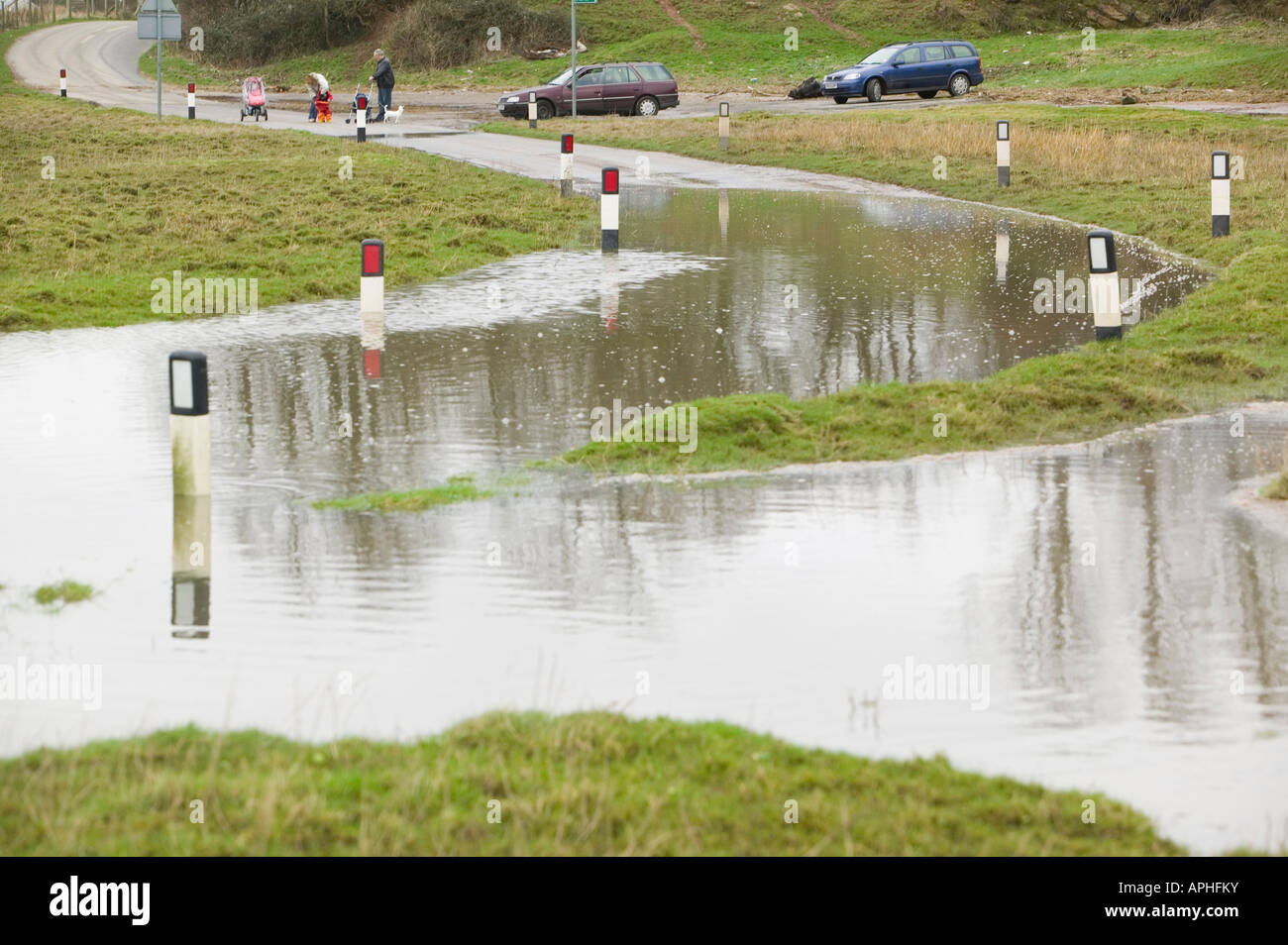 A road near Sunderland Point Morecambe Bay UK flooded by a combination ...