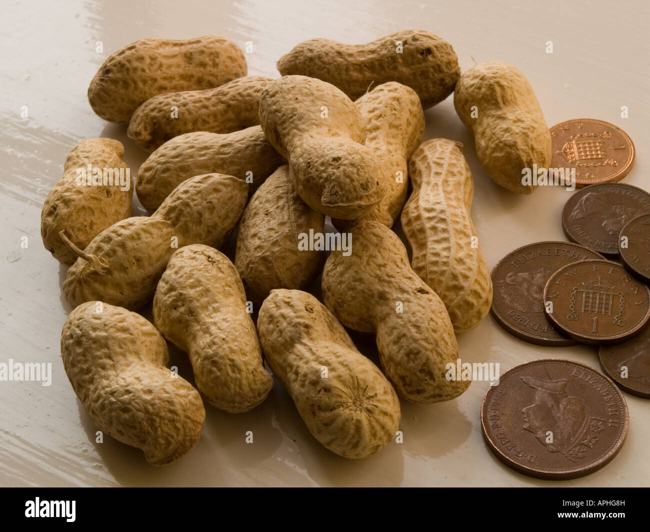 peanuts small change coins Stock Photo - Alamy