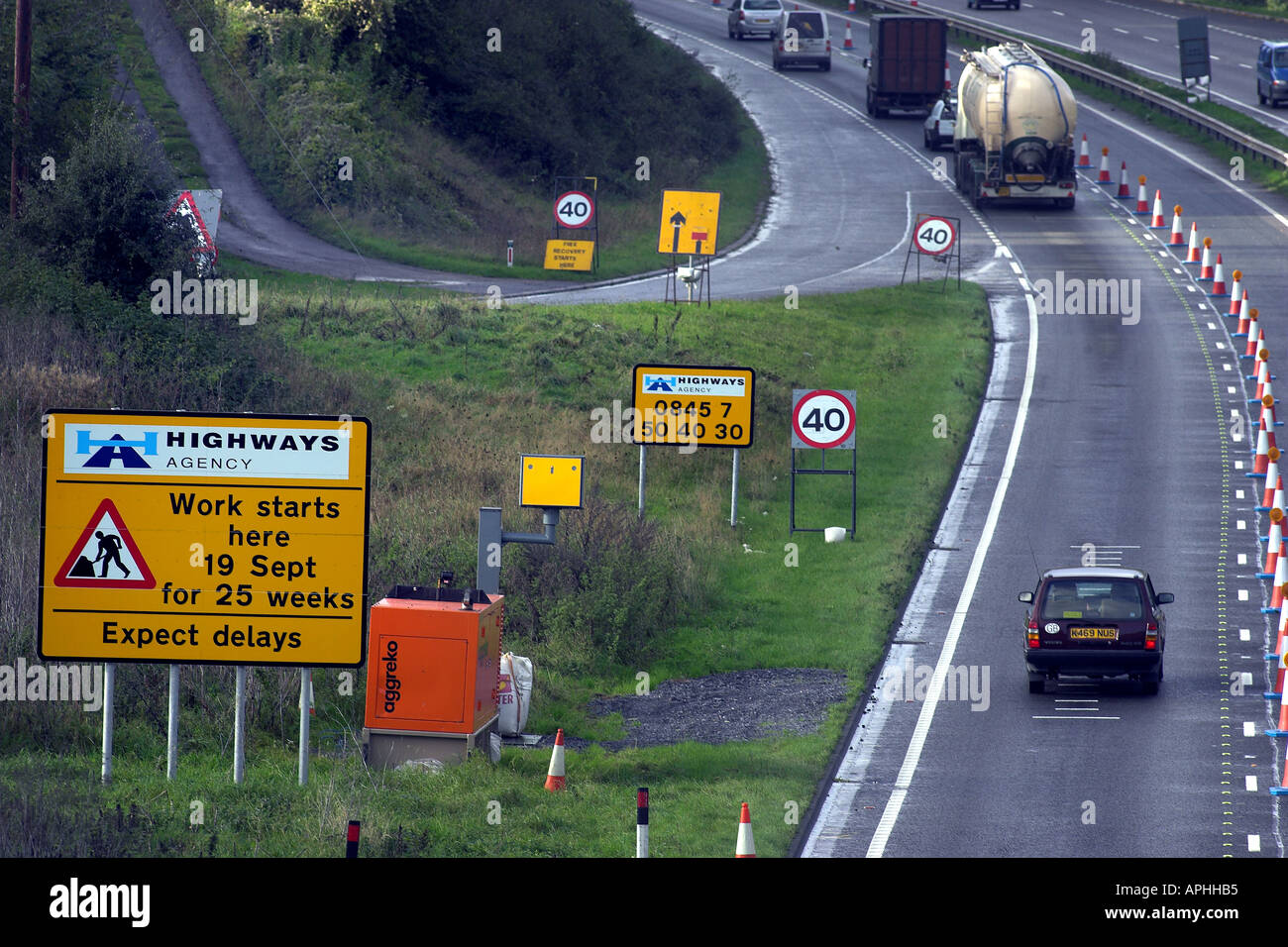 Traffic signs and speed camera beside restricted lanes on the A38 in ...