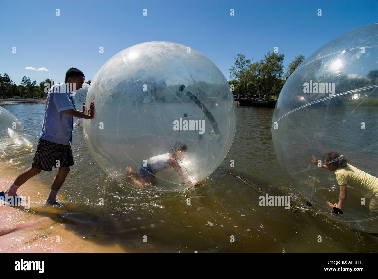 Inflated plastic balloons are a fun way to enjoy the water without ...