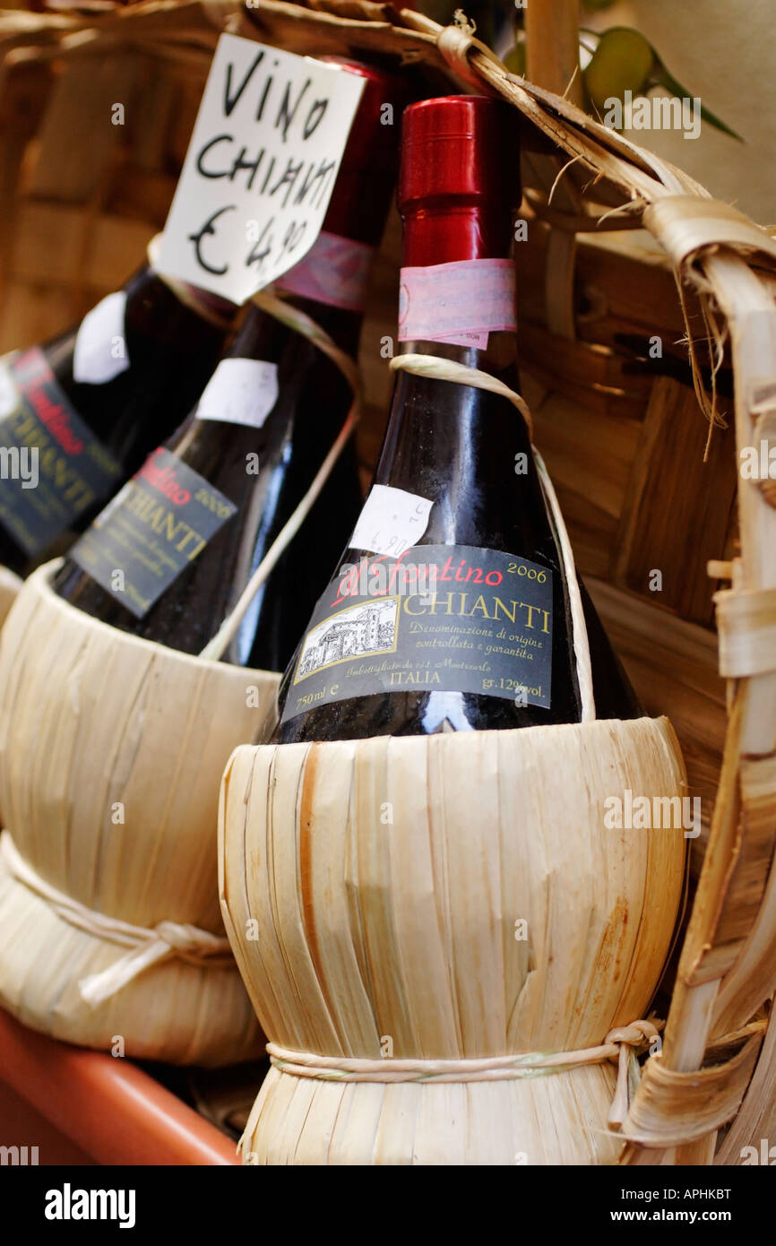 Bottles of Italian Chianti red wine in front of the local store in ...