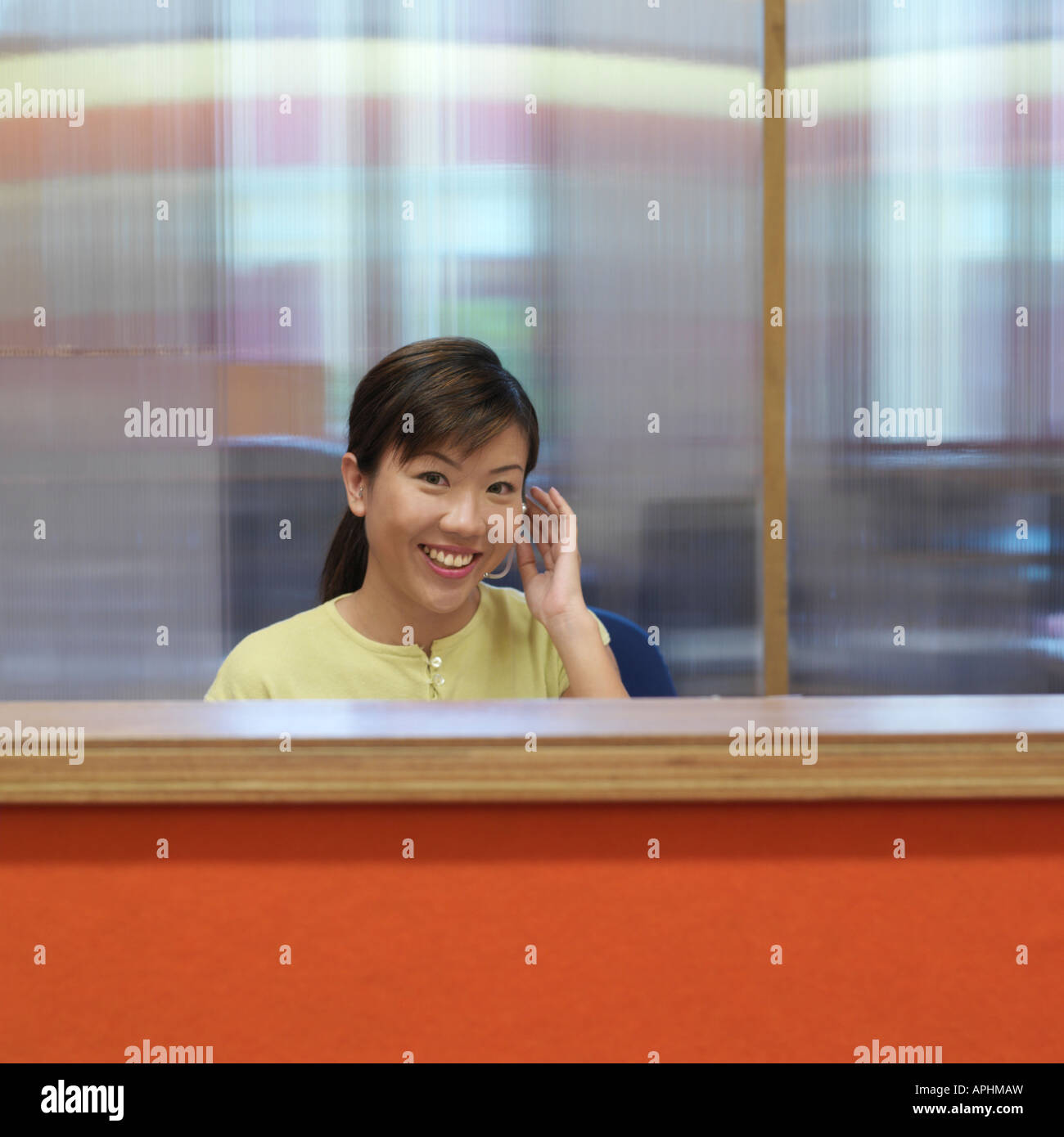 Young woman receptionist smiling portrait Stock Photo - Alamy