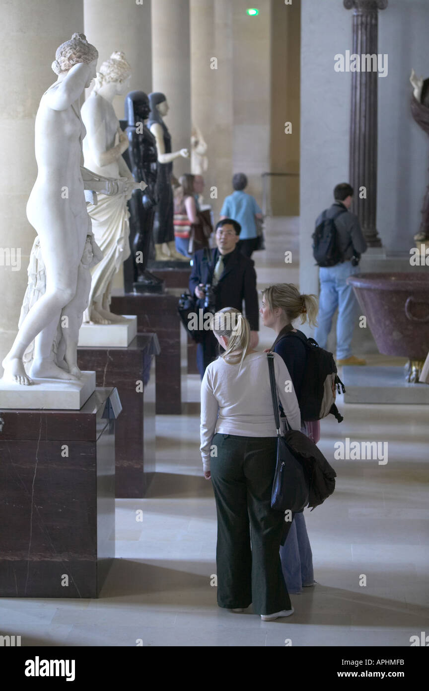 Pic By Edward Moss Visitors to a museum in Paris France look at one of ...