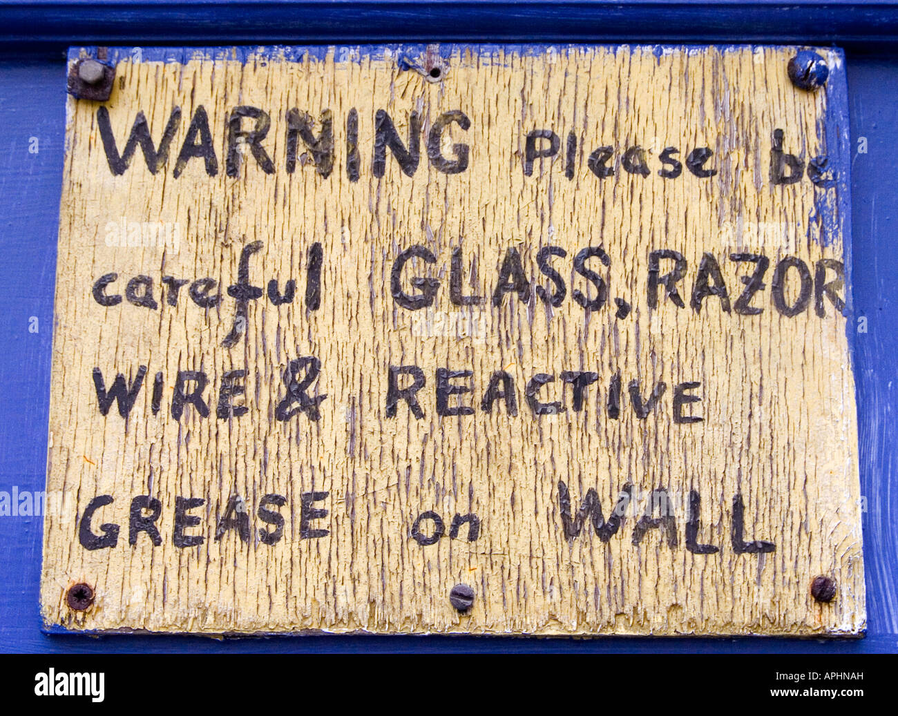 Warning sign on a wall Stock Photo - Alamy