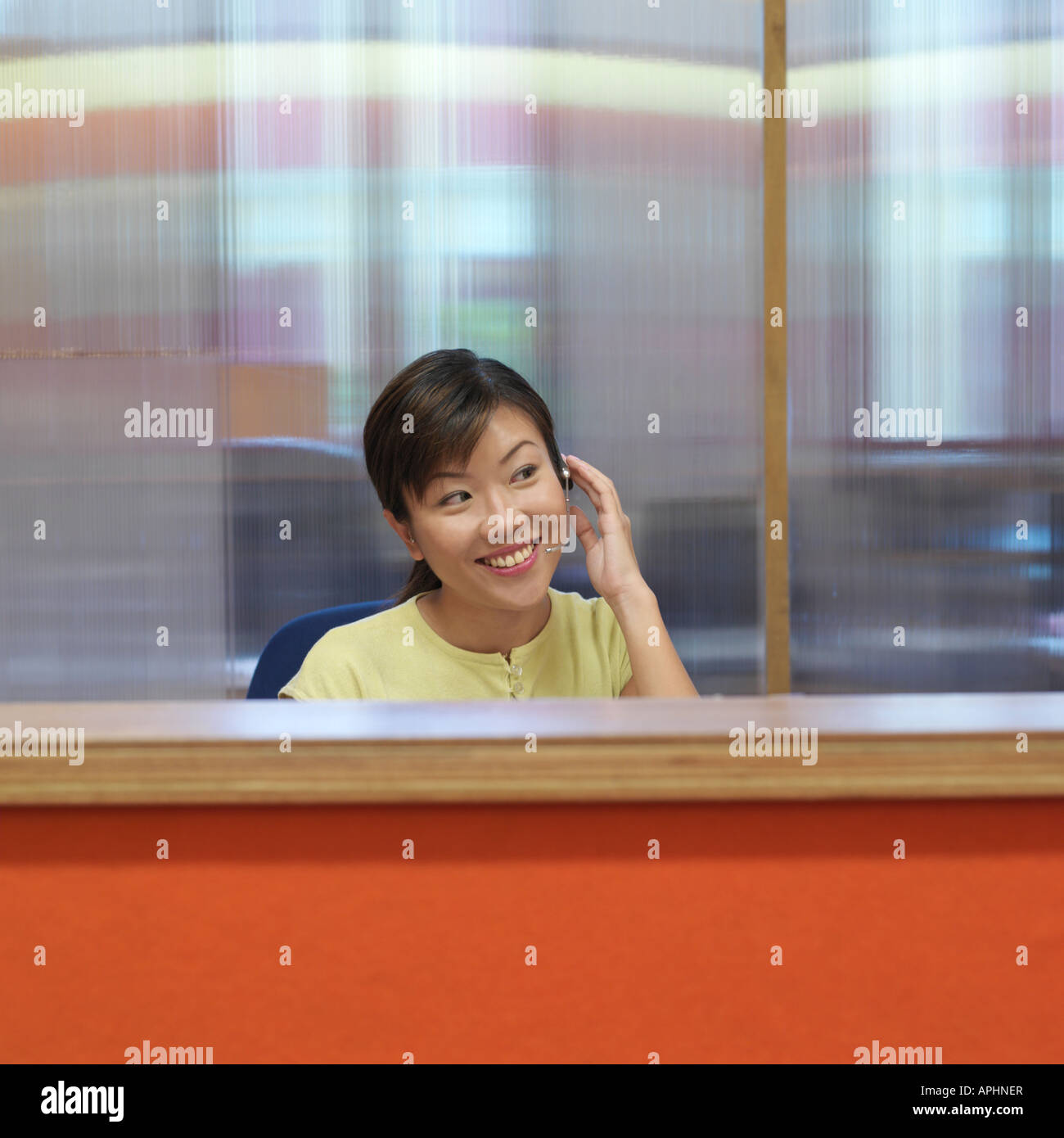Young woman receptionist smiling portrait Stock Photo - Alamy