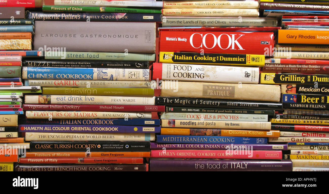 Piles of cookery books Stock Photo - Alamy