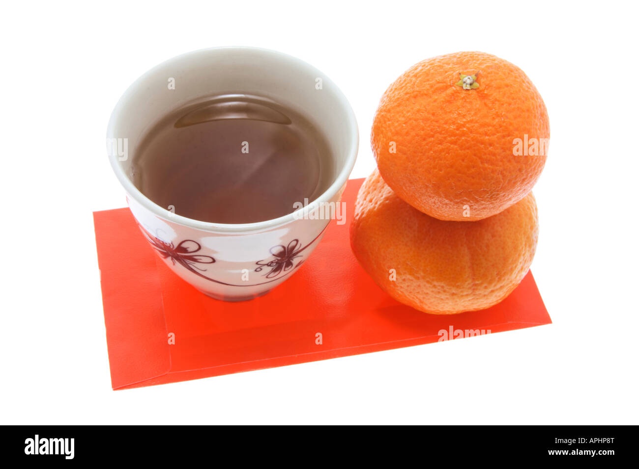 Cup of Chinese Tea with Mandarins and Red Packet Stock Photo - Alamy