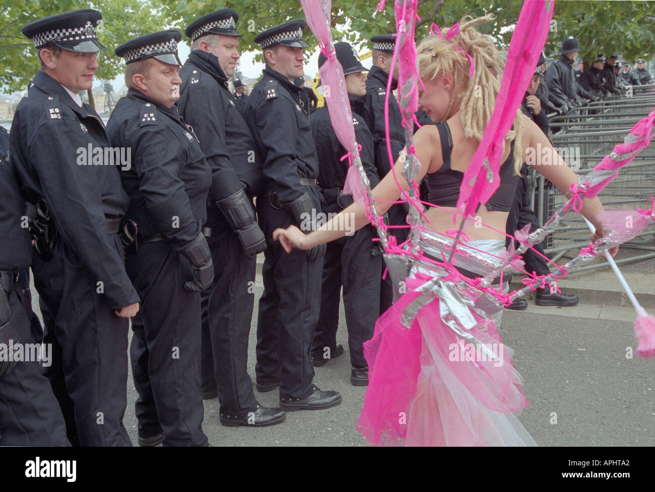 Protesters teasing the police line-up at the Arms trade fair ...
