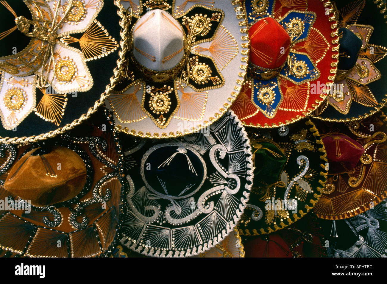 Viewed from above the crowns and brims of ornately decorated ...