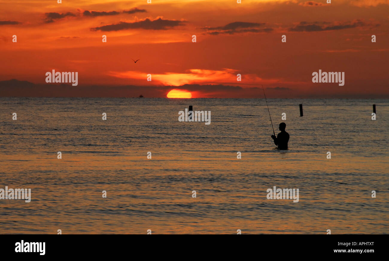 Fishing at Sunset Stock Photo - Alamy