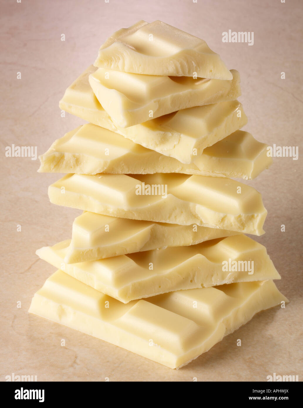 STACK OF WHITE CHOCOLATE PIECES Stock Photo - Alamy