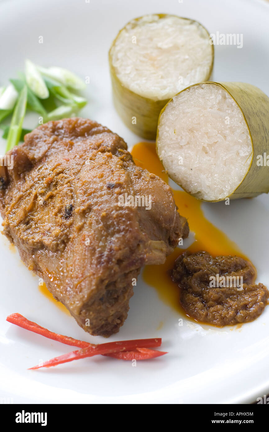 Chicken rendang with lemang Stock Photo - Alamy