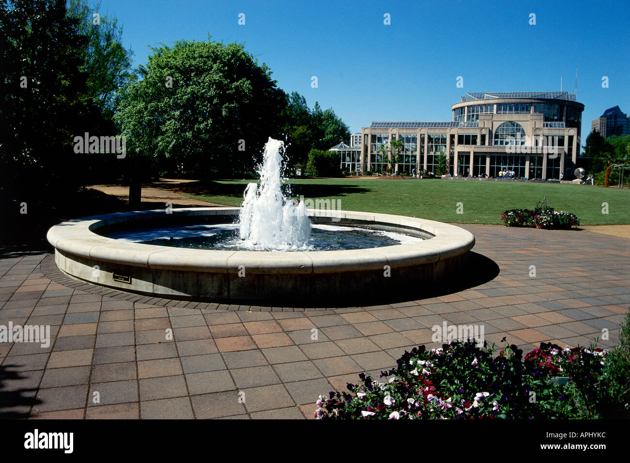 A fountain playing in a paved area in front of the Dorothy Chapman ...