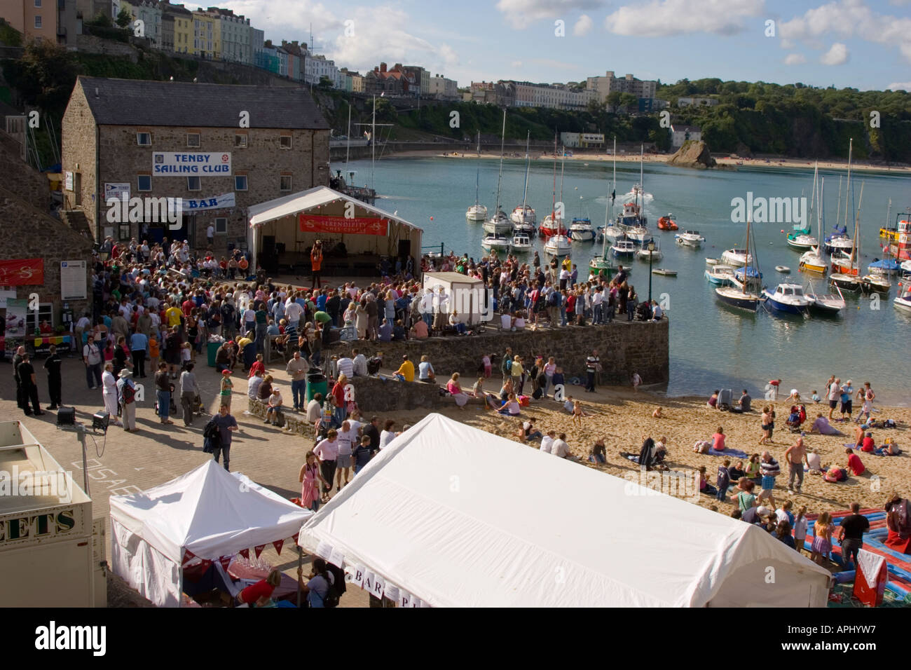 Crowded beach and harbour quay in Tenby Pembrokeshire Stock Photo - Alamy