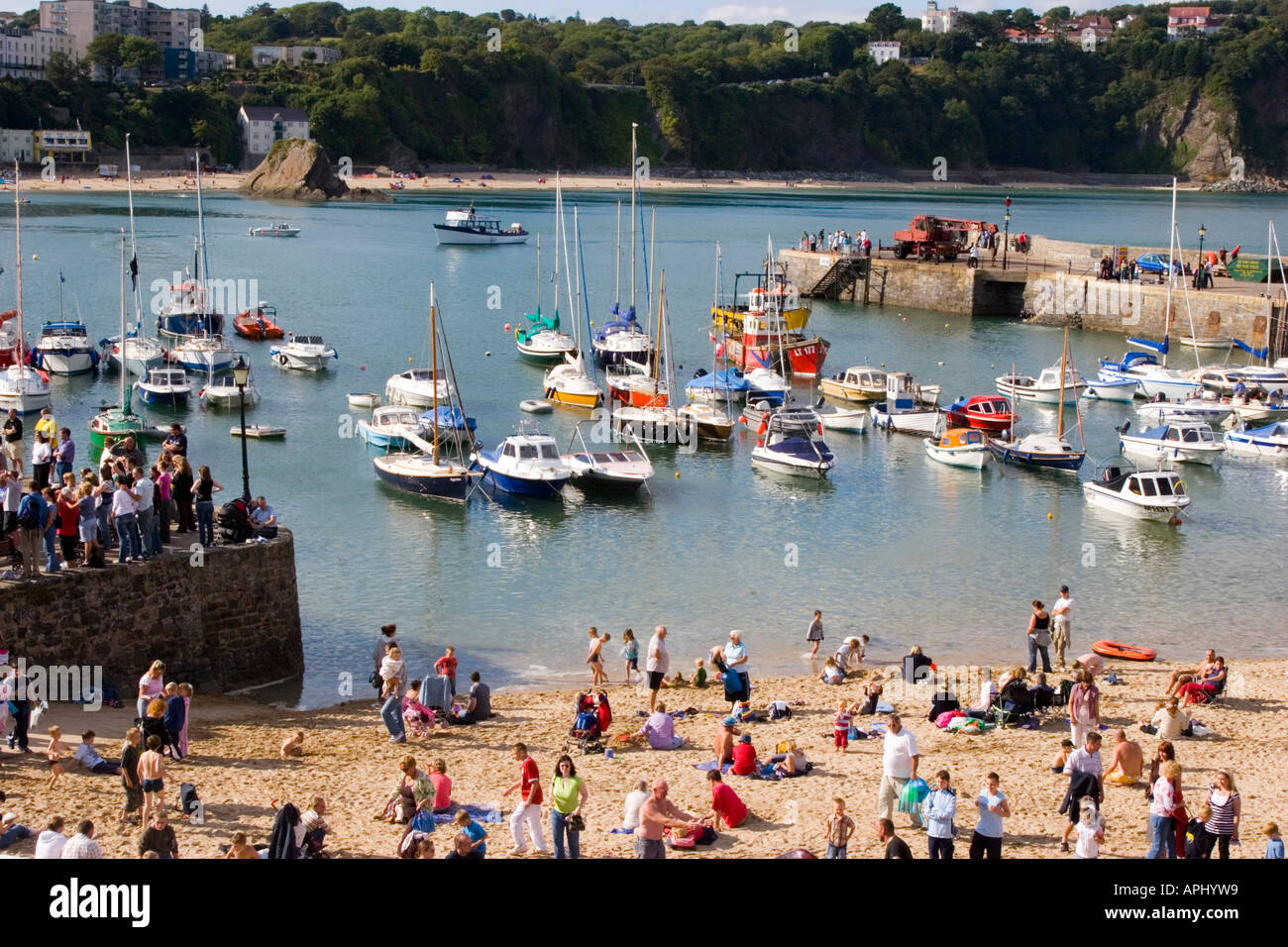 Crowded beach and harbour quay in Tenby Pembrokeshire Stock Photo - Alamy