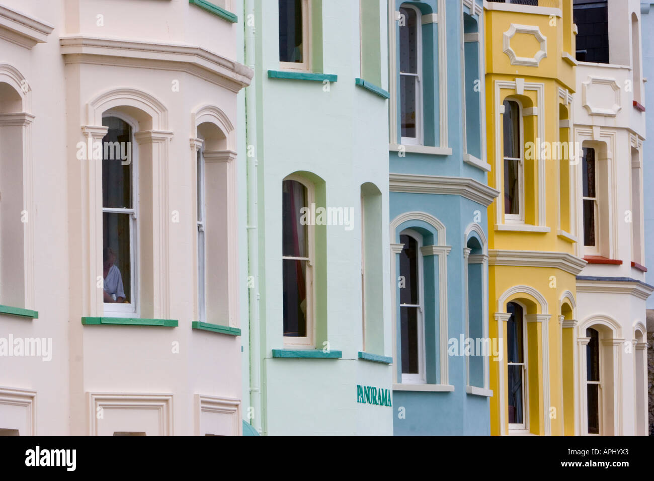 Windows of terraced houses in Tenby Pembrokeshire Stock Photo - Alamy