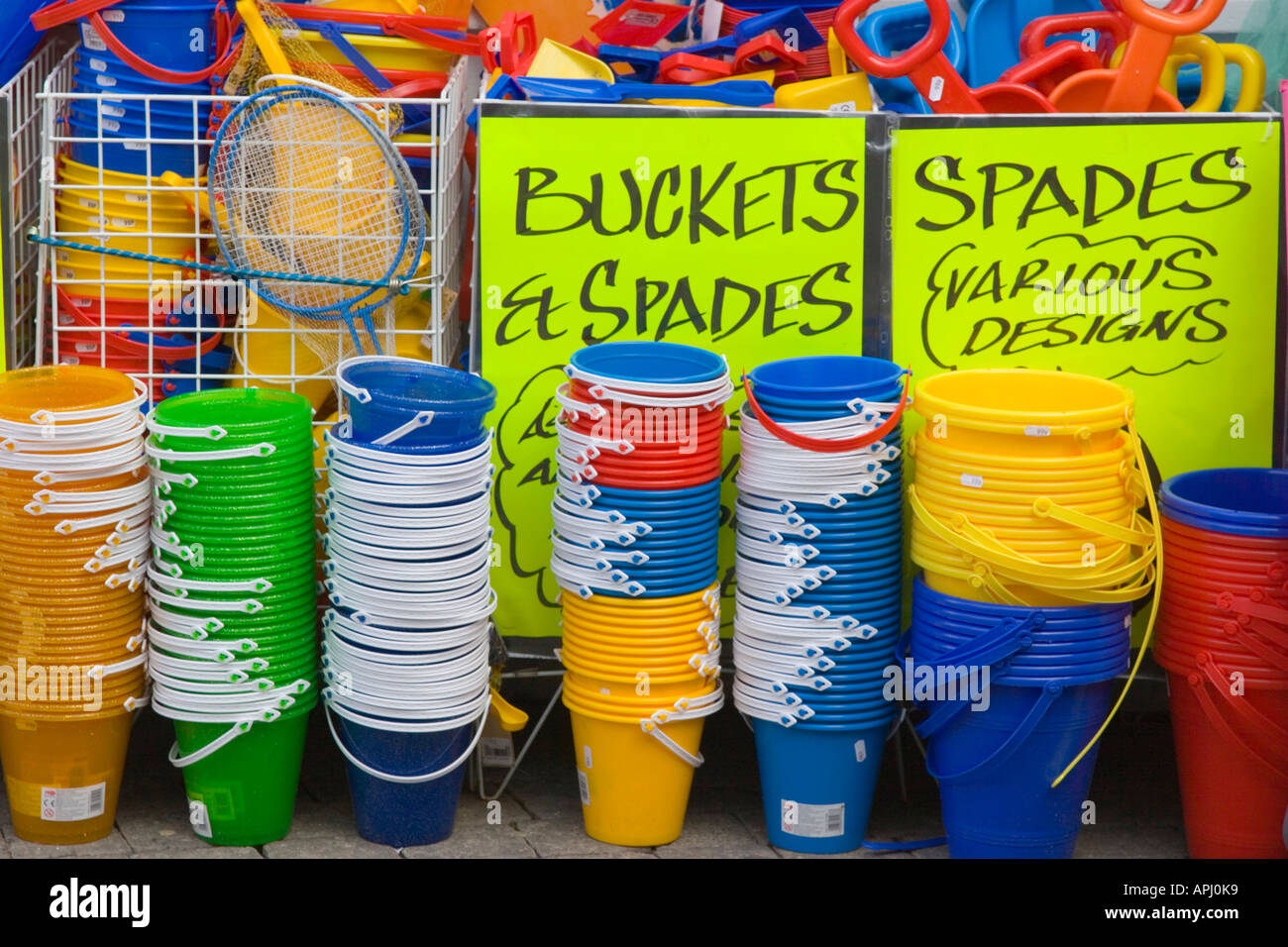 Colourful buckets and spades at a seaside souvenir shop Stock Photo - Alamy