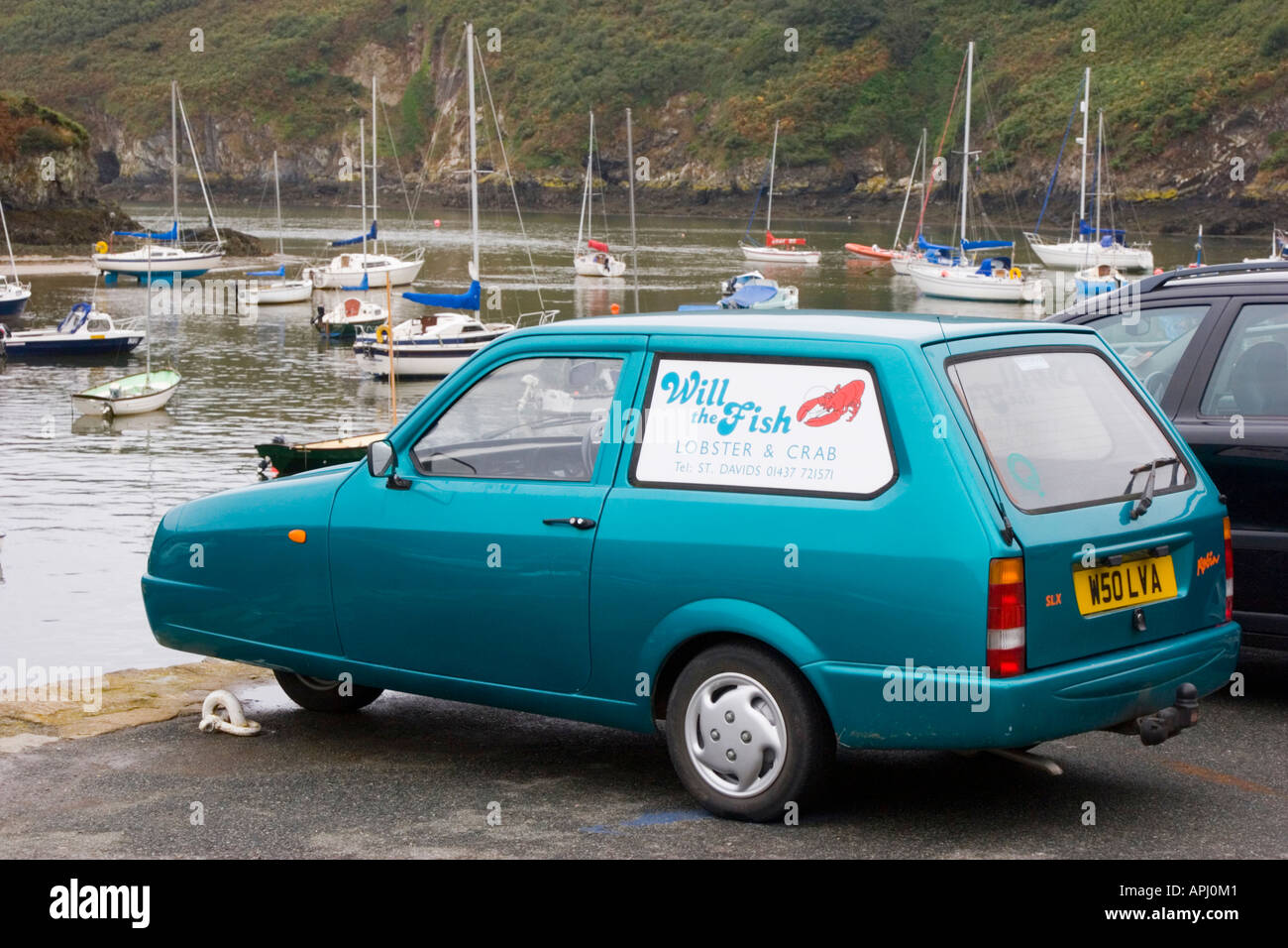 Fishmonger's Reliant Robin three wheeled van in Solva harbour Stock ...