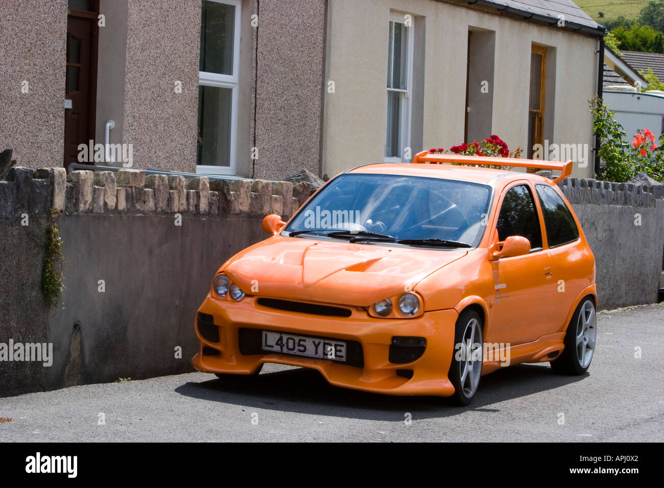 Boy racer parked outside grandma's bungalow Stock Photo - Alamy
