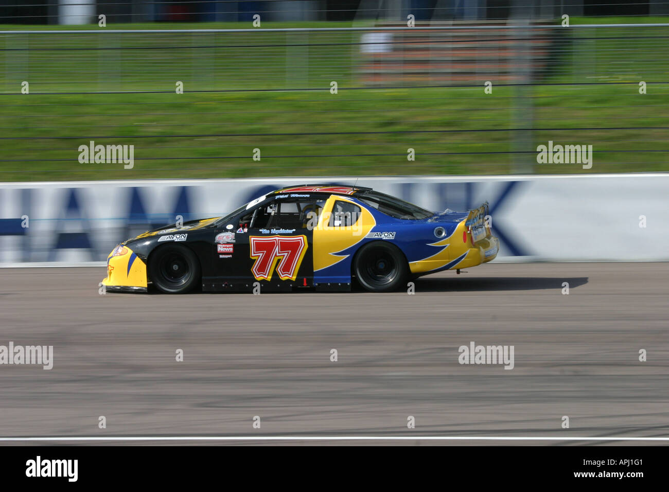 V8 Nascar type stock cars racing on a banked oval circuit Stock Photo ...