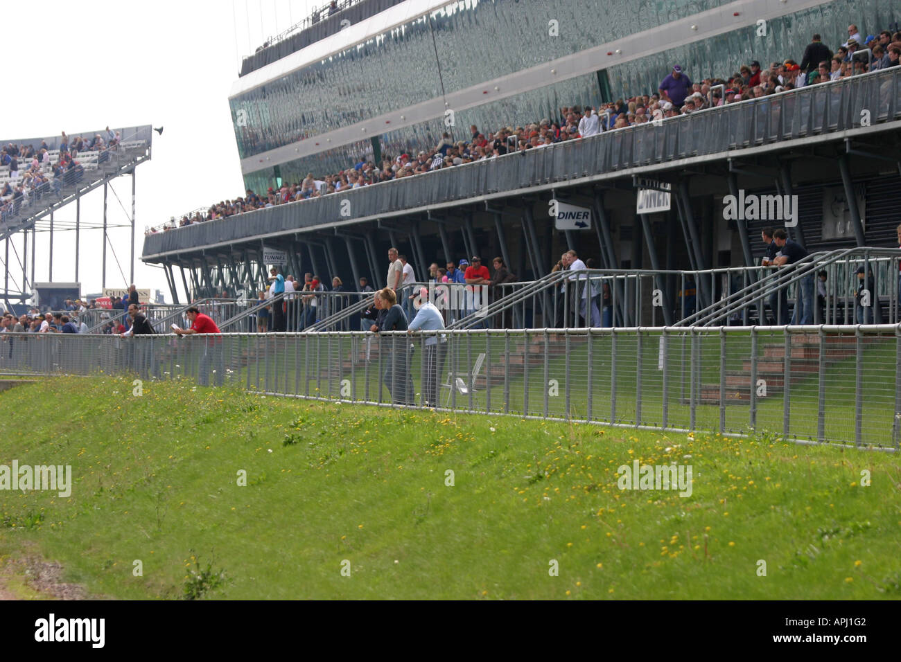 Spectators in a grandstand at a motor sport event Stock Photo - Alamy