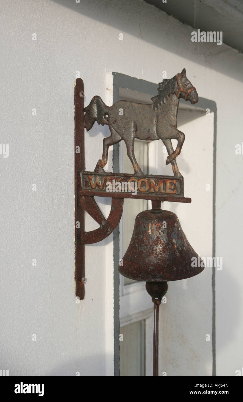 Welcome sign with horse and bell Stock Photo - Alamy
