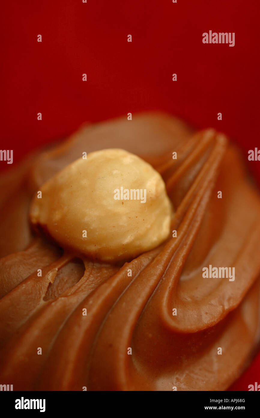 Luxury milk chocolate with large hazelnut topping Stock Photo - Alamy