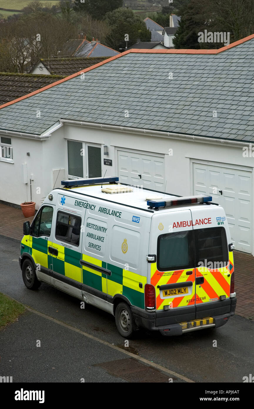 an ambulance parked on the road outside a house Stock Photo - Alamy