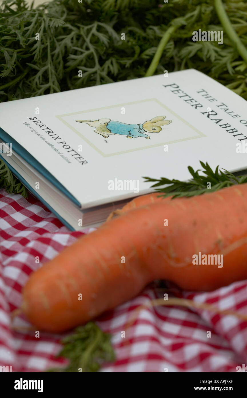 The Tale of Peter Rabbit by Beatrix Potter, and carrots Stock Photo - Alamy
