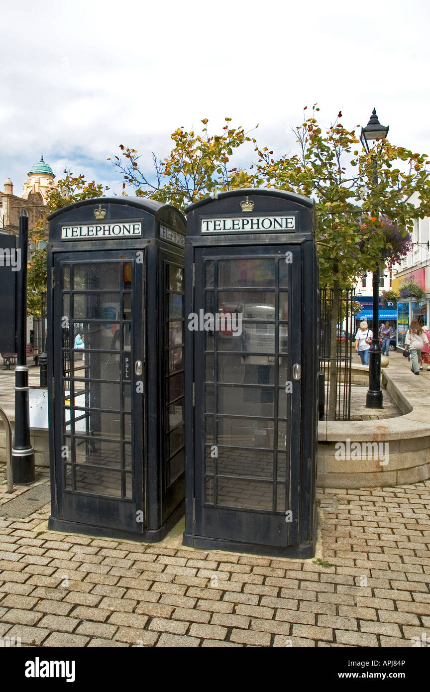 two black painted telephone boxes in camborne, cornwall Stock Photo - Alamy
