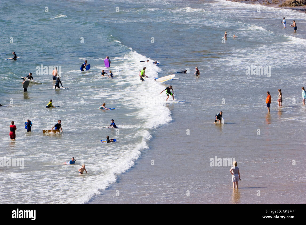 Surfers swimmers sunny coastal beach hi-res stock photography and ...
