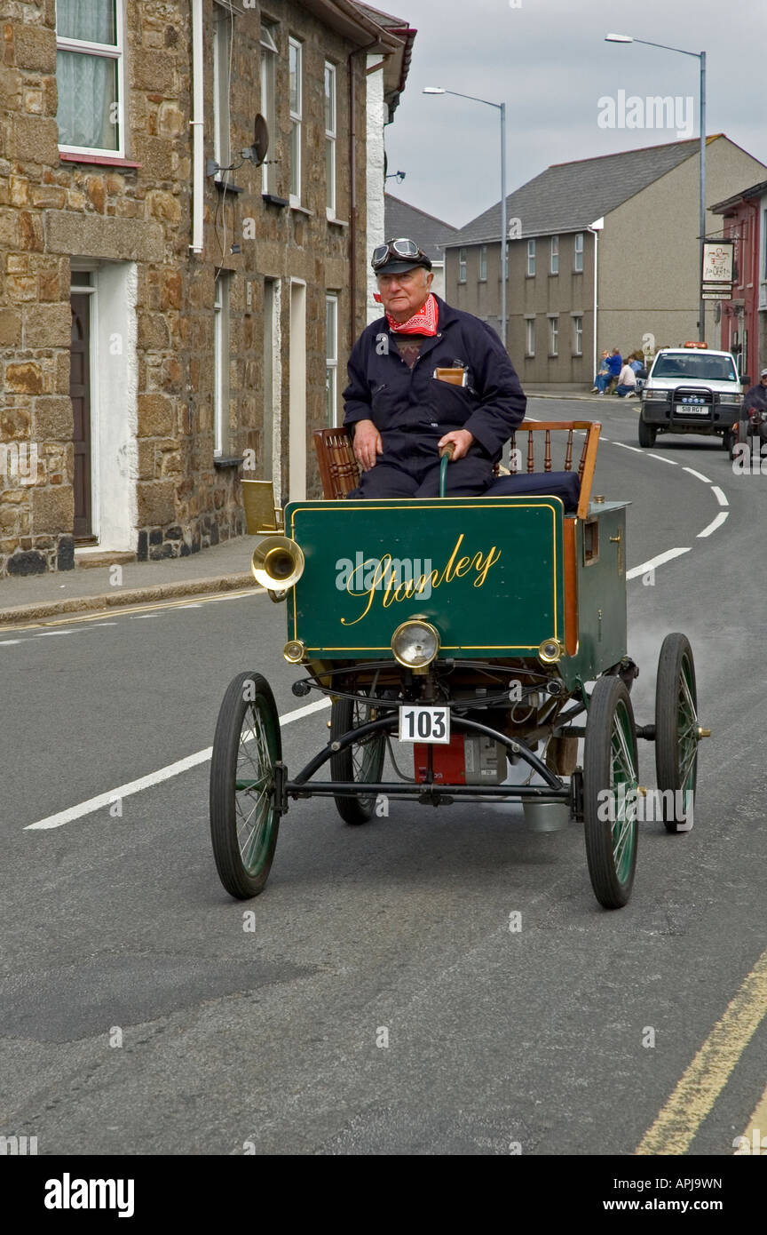 a man driving an old style own design motercar Stock Photo - Alamy