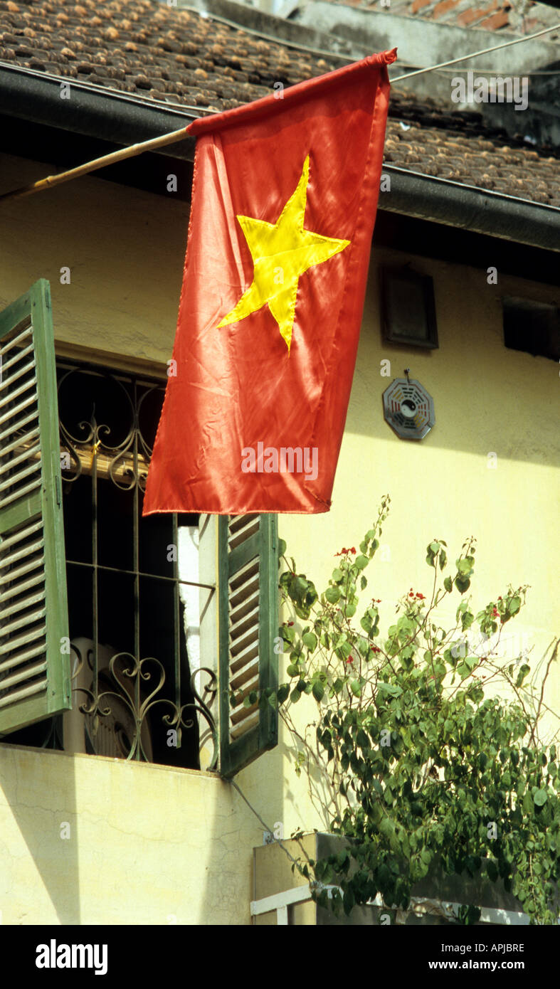 Vietnamese flag flying above green shuttered window in Hanoi Old ...